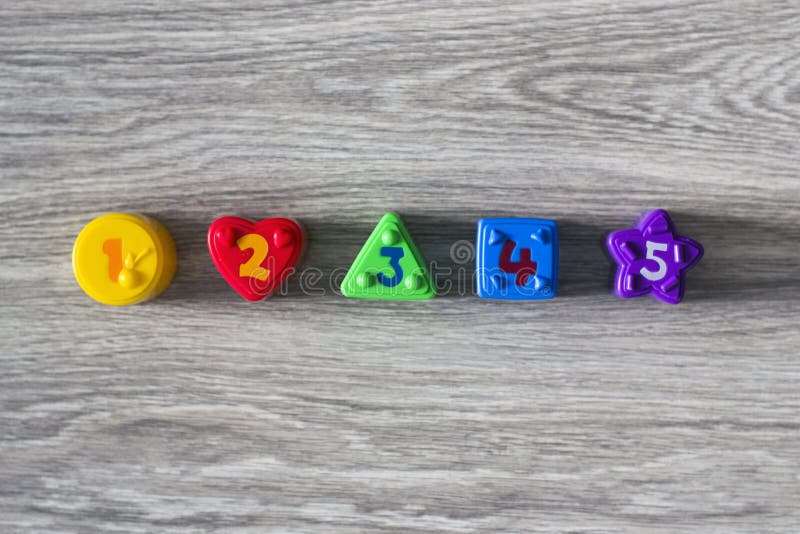 Colorful Plastic Shapes with Numbers on a White Background Stock Photo ...