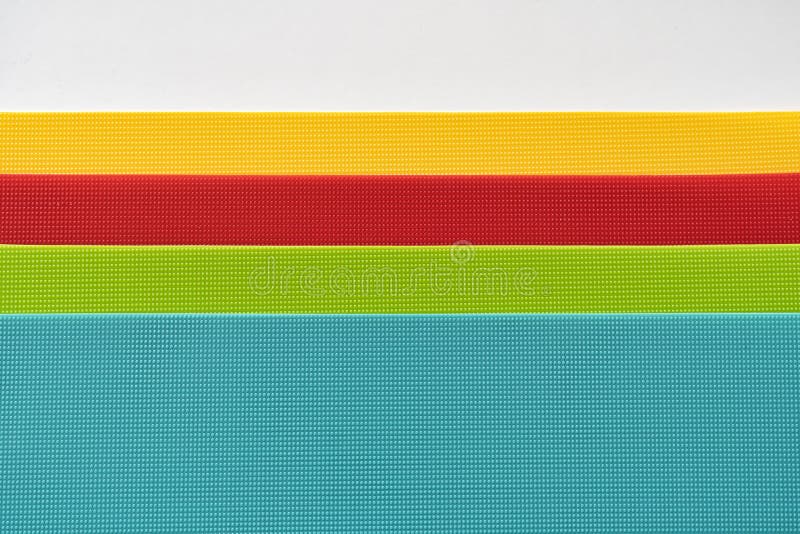 Colorful Plastic Sheets with Tiny Dots on a White Background Stock ...