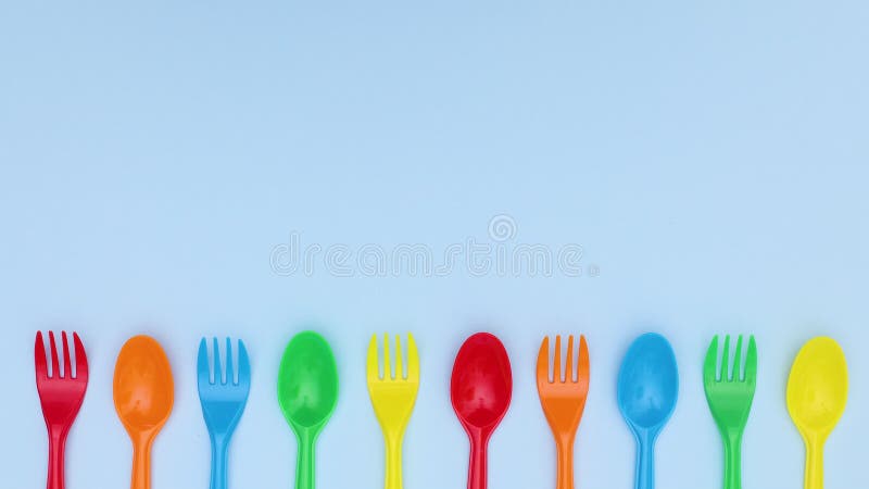 Colorful Plastic Spoons and Forks Appear and Disappear on Bottom of ...