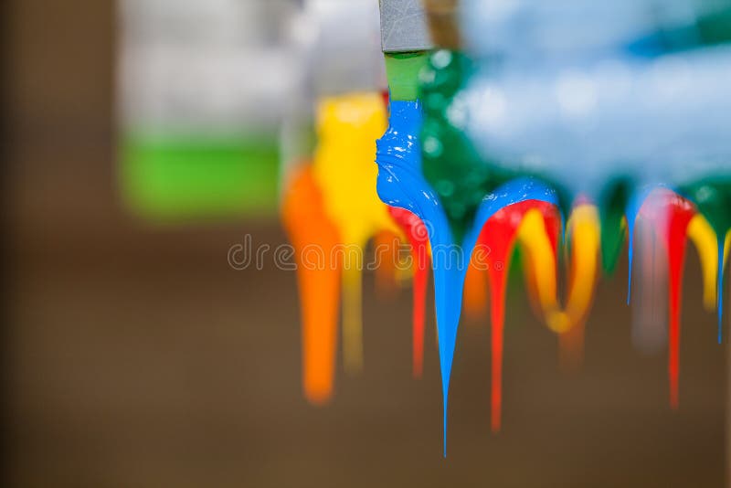 Colors Dripping from the Rubber Print Handle Stock Photo - Image of ...