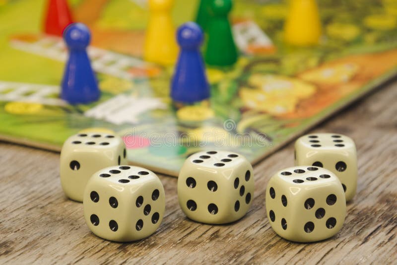 Colorful Play Figures with Group of Dice on Board Stock Image - Image ...