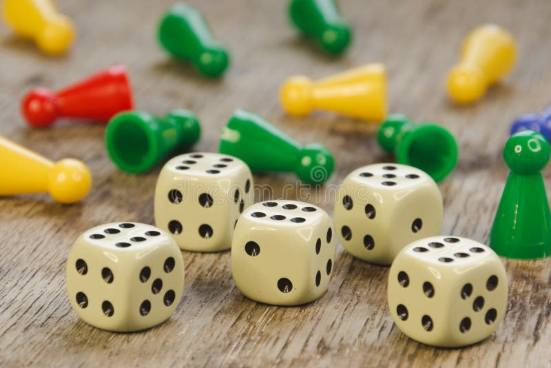 Colorful Play Figures with Group of Dice on Board Stock Photo - Image ...
