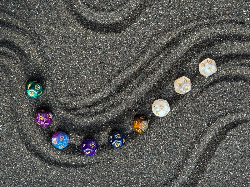 Colorful Polyhedral Dice Arranged in a Curved Line on Textured Black ...