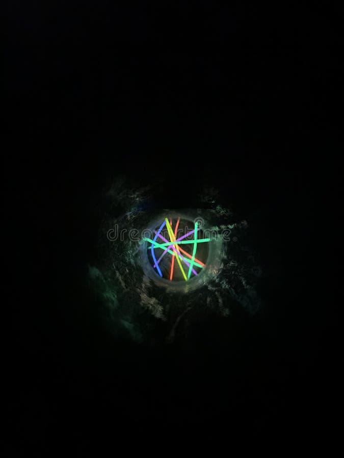 A Rainbow Ball Surrounded by Smaller Bright Objects in the Dark Stock ...