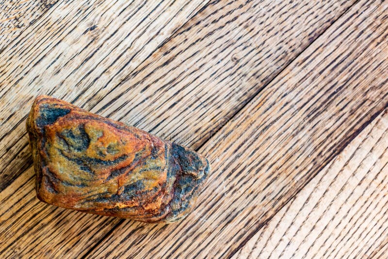 Colorful Rainbow Stone on Rustic Wood Background Stock Image - Image of ...