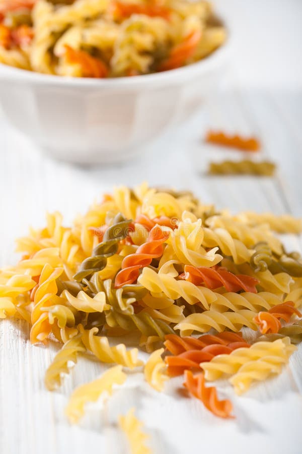 Colorful Raw Pasta on the Table and in a Bowl Stock Image - Image of ...