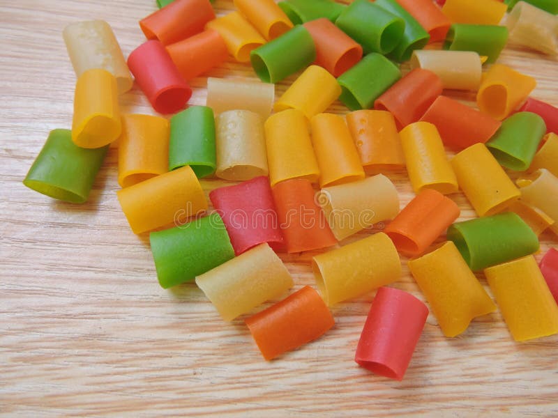 Colorful Ready To Fry Pipe Shaped Snacks on the Table. Stock Photo ...