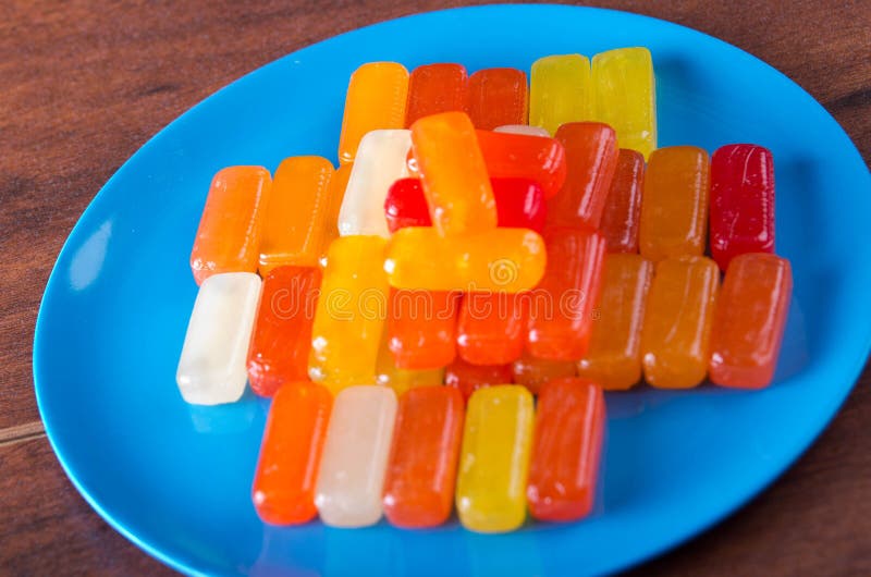 Colorful Rectangular Hard Candy Placed on Blue Plate with Wooden ...