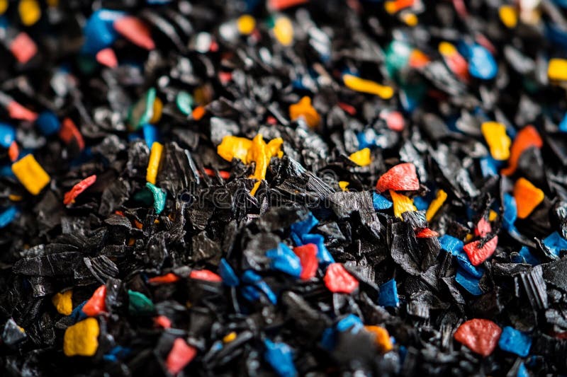 Colorful Recycled Plastic Granules are Scattered on a Surface ...