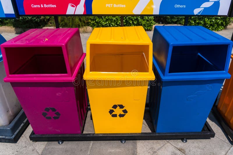 Colorful Recycling Bins in a Row for Paper, Plastic, and Trash Stock ...