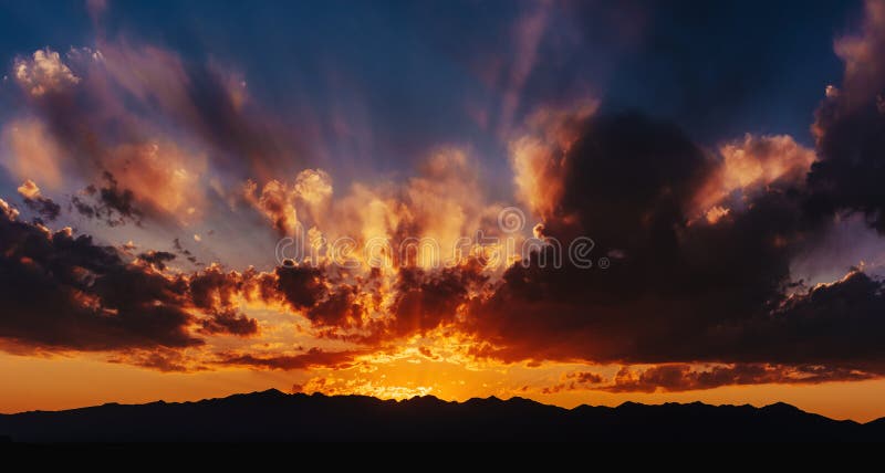Colorful Dramatic Sky at Sunset Light with Mountains Silhouettes Stock ...