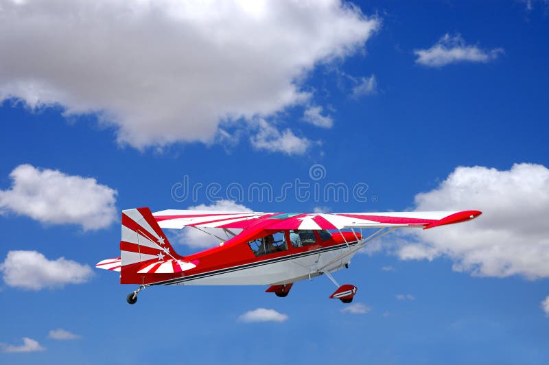Colorful Red Plane in Flight Stock Photo - Image of colorful, flying ...