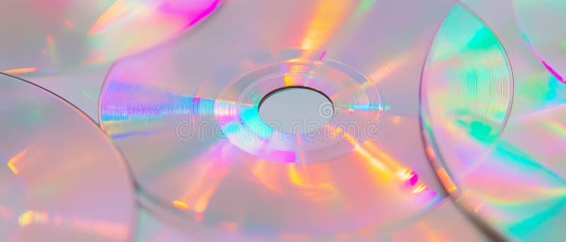 Reflective Surfaces of Compact Discs Highlight Colorful Patterns and ...