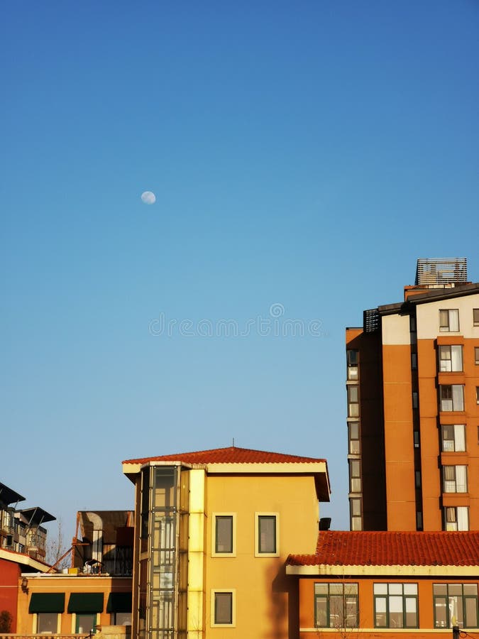 Colorful, Residential Buildings and the Moon in Daylight, Vertical ...