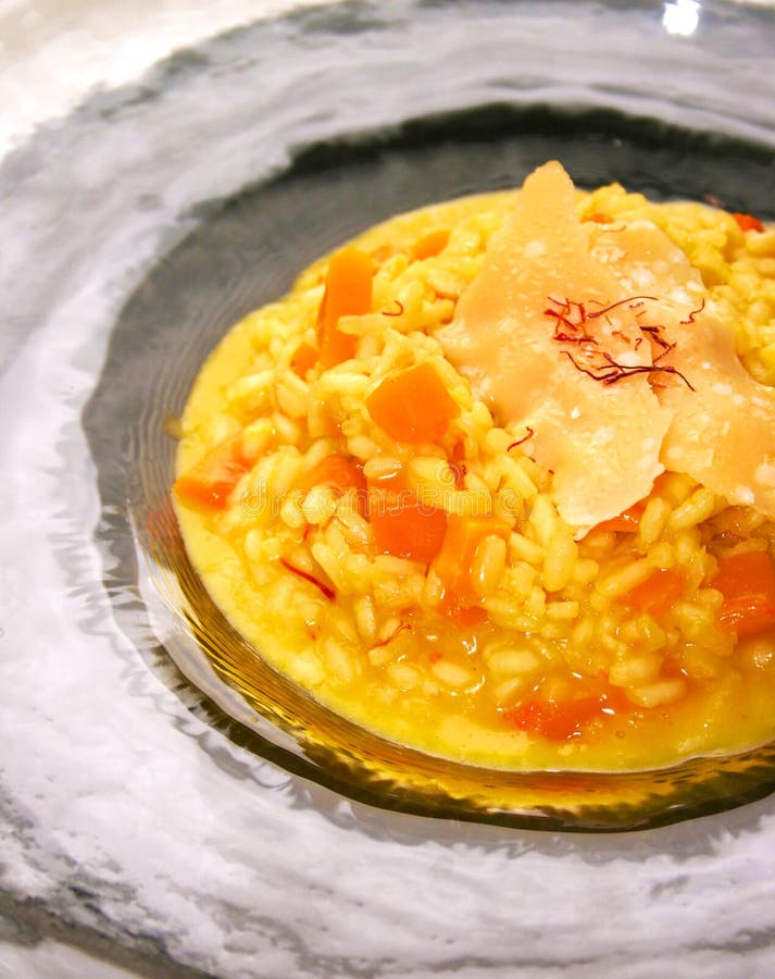 Colorful Risotto with Carrots, Parmesan Cheese and Saffron Stock Photo ...