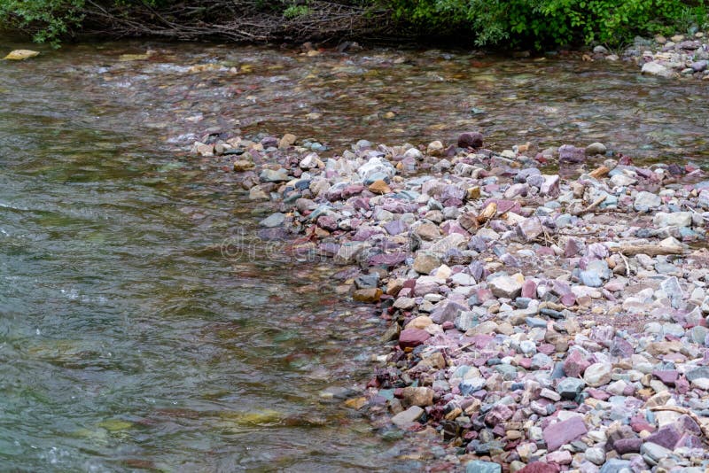 Colorful River Rocks in the River in Glacier National Park Stock Photo ...