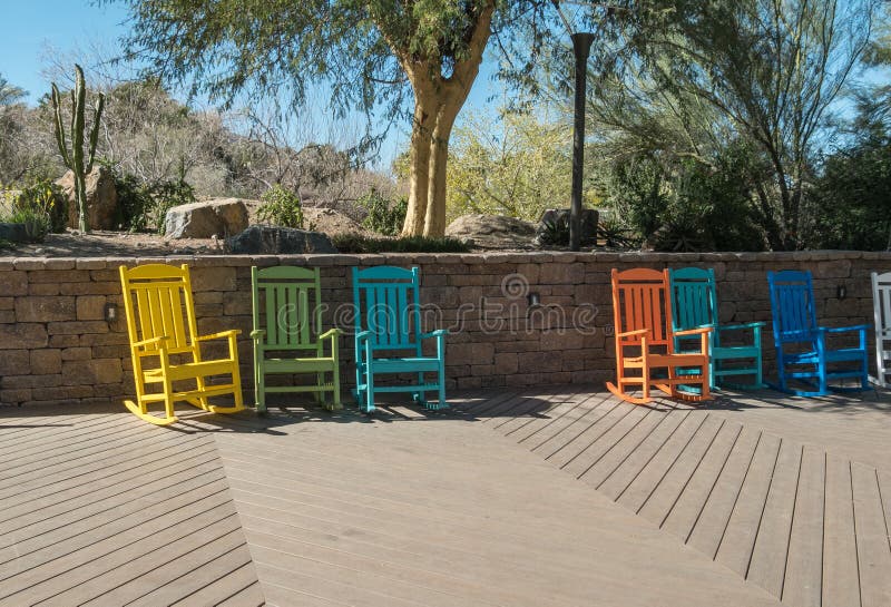 Colorful rocking chairs stock image. Image of lodging - 174352555
