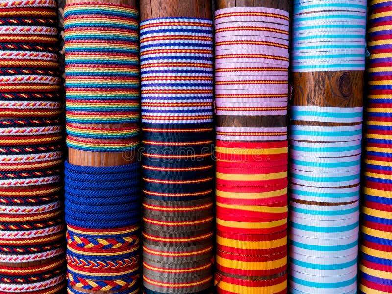 Colorful Rolled Fabric Display with Various Patterns and Textures Stock ...