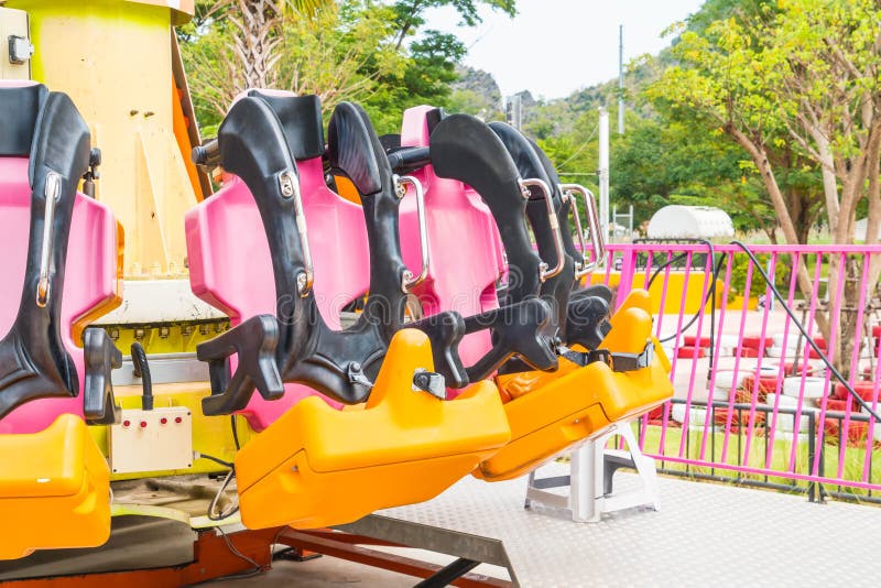 Colorful Roller Coaster Seats at Amusement Park Stock Image - Image of ...