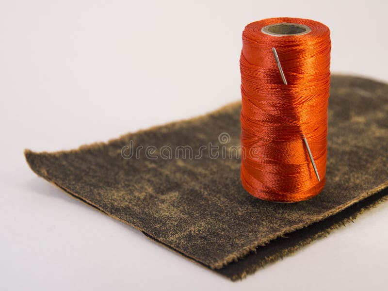 Colorful Rolls of Thread on a Piece of Leather. Stock Image - Image of ...