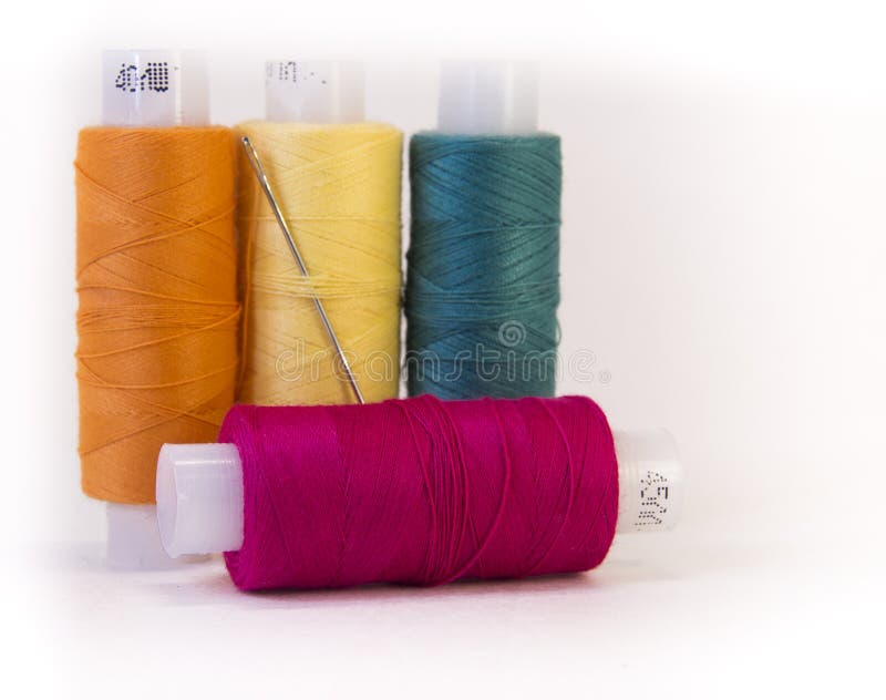 Colorful rolls of thread. stock image. Image of cmykcolors - 65989055