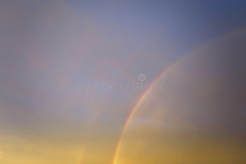 Colorful Round Rainbow Against Blue Evening Sky after Heavy ...