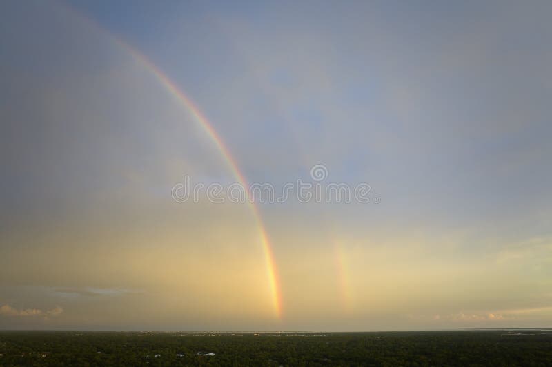 Colorful Round Rainbow Against Blue Evening Sky after Heavy ...