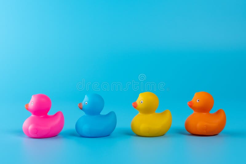 Colorful Rubber Ducks on Blue Background. Summer Minimal Concept Stock ...