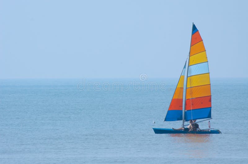 Colorful Catamaran with Striped Sails Stock Image - Image of boat, sail ...