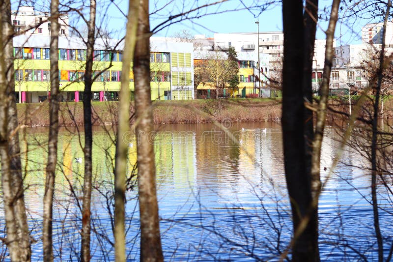 Colorful School Building by a Lake Stock Photo - Image of tranquil ...