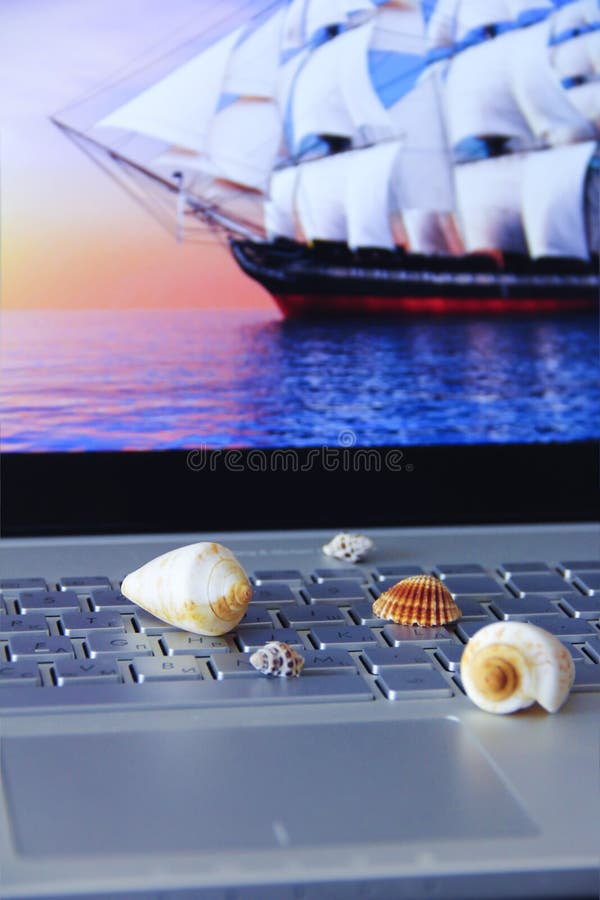 Colorful Seashells Lie on a Silver Computer Keyboard Against the ...