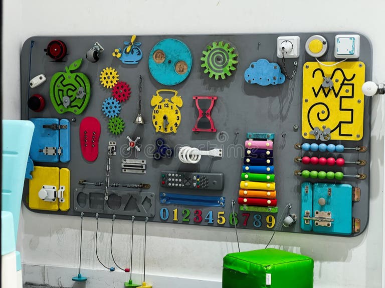 Colorful Sensory Activity Board with Interactive Components for Play ...