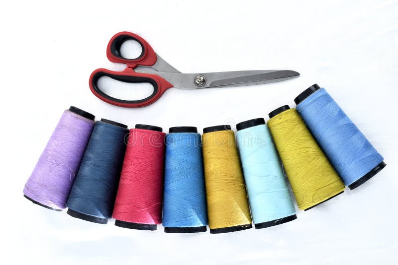 Colorful Sewing Thread Reels on White Background with Scissors Stock ...