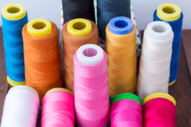 Multi-colored Sewing Threads Stand on a Wooden Table Stock Photo ...