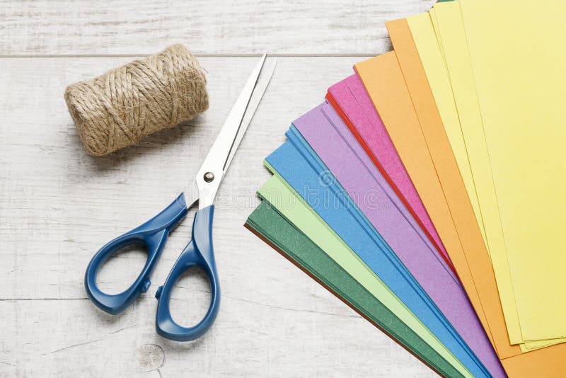 Colorful Sheets of Paper, Scissors and String on Wood Stock Image ...