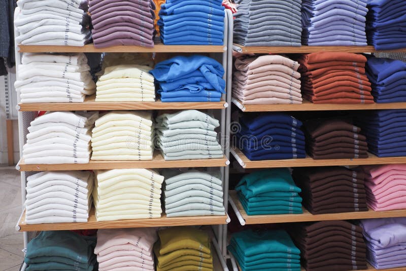 Colorful Shirts on Shelf in a Retail Shop Stock Photo - Image of choice ...