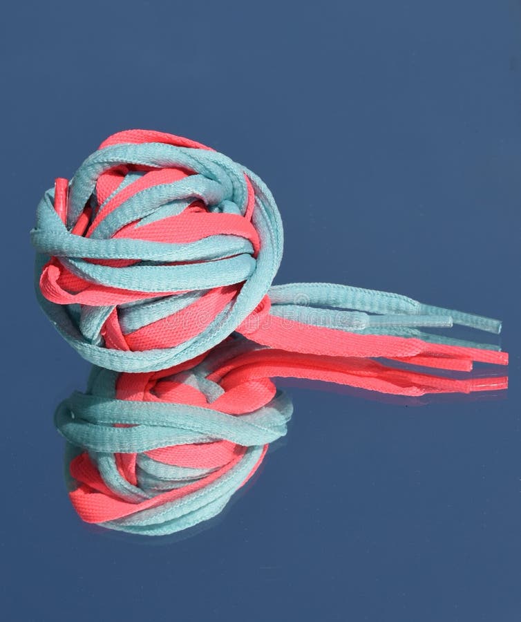 Colorful Shoe Laces Tangled Up As Ball with Reflection on Mirror Stock ...