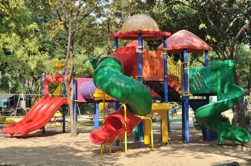 Colorful Sliders in Public Playground in Garden. Stock Image - Image of ...