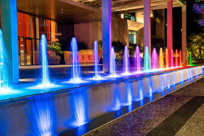 Colorful Small Fountains in Front of a Luxurious Hotel at Night Stock ...