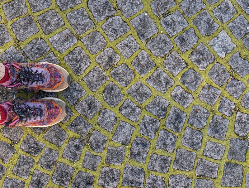 Colorful Sneakers on Cobblestone Path Stock Image - Image of asphalt ...