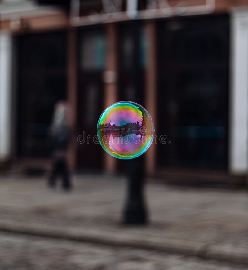 A Colorful Soap Bubble with a Rainbow Ring Floating in Front of ... A Colorful Soap Bubble with a Rainbow Ring Floating in Front of ...