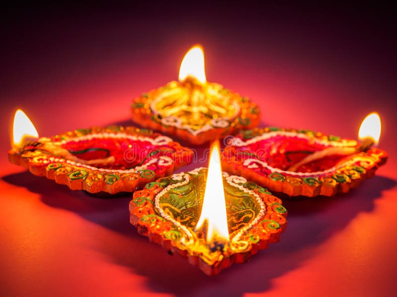 Colorful And Sparkling Clay Diya Lamps Lit For The Hindu Diwali Stock