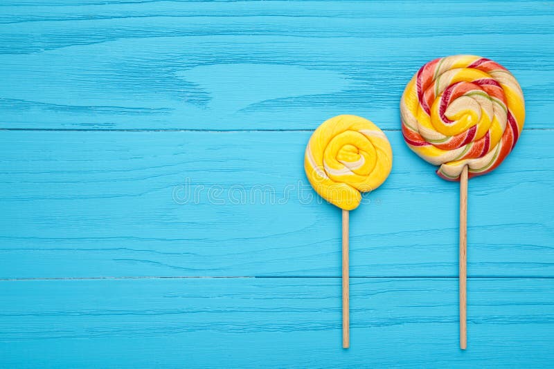 Colorful Spiral Lollipops on Blue Background. Candy Stock Photo - Image ...