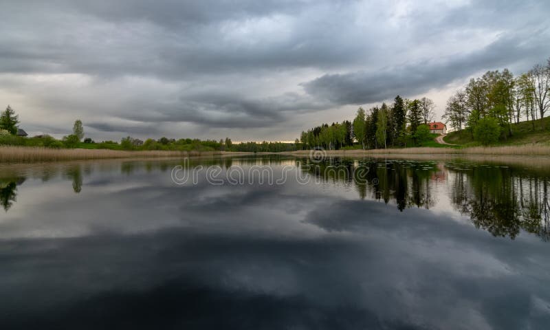 Spring Landscape with Beautiful Sky, Clouds and Tree Reflections in the ...