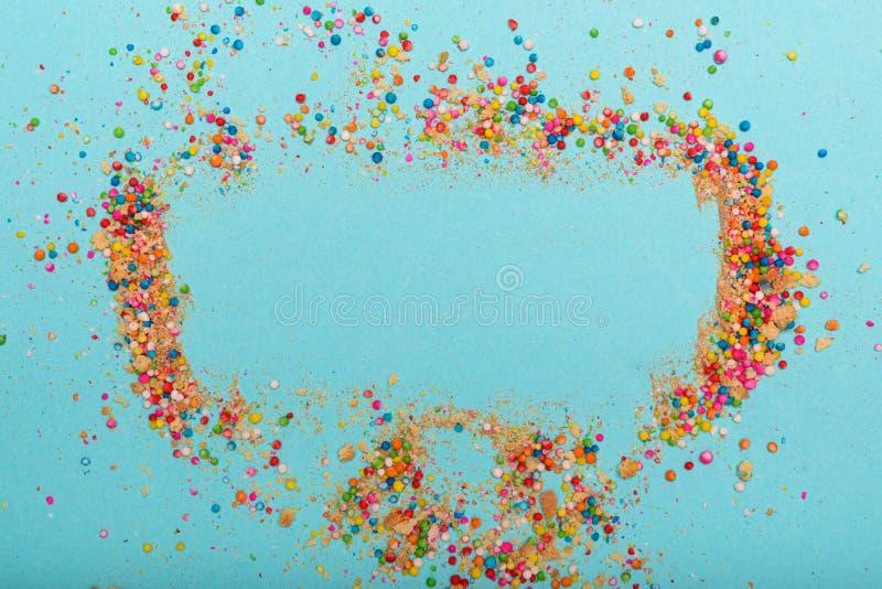 Colorful Sprinkles and Crumbs Create a Vibrant Border Around a Blank, Light Blue Space, Ideal ...