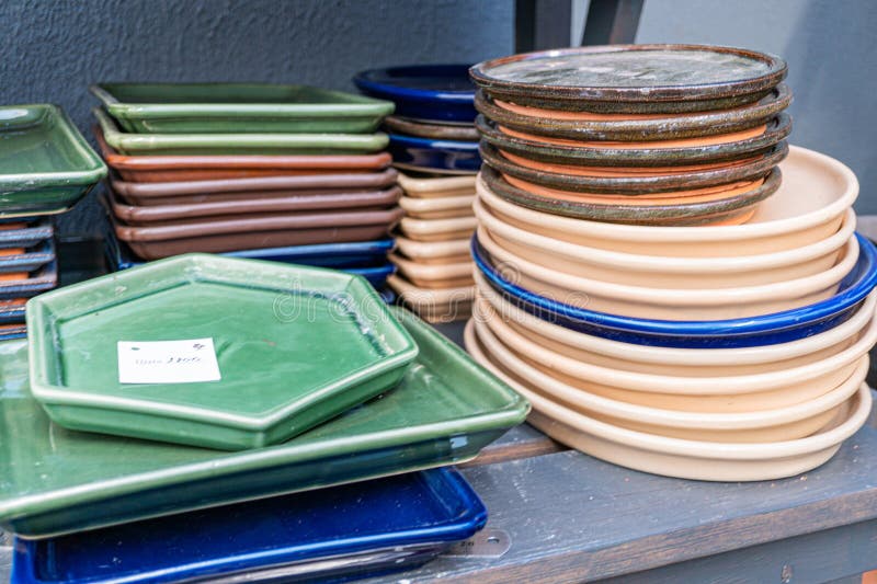 A Colorful Stack of Ceramic Plates Displayed in a Market or Retail ...