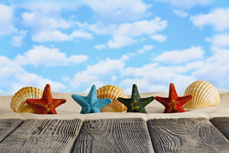 Colorful Starfishes and Shell on the Beach Sand and Wooden Table with ...