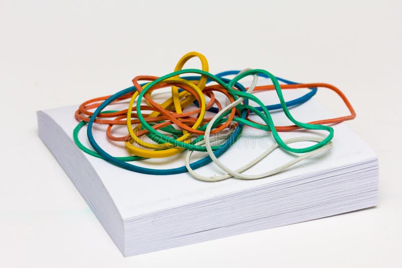 Colorful Stationery Rubber Bands Lying on the Stack of Paper for Stock ...