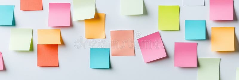 Colorful Sticky Notes and Paper Tabs Organized on a White Desk Surface ...