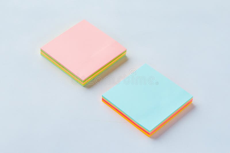 Colorful Sticky Notes Stacked on a Light Surface in a Workspace Setting ...